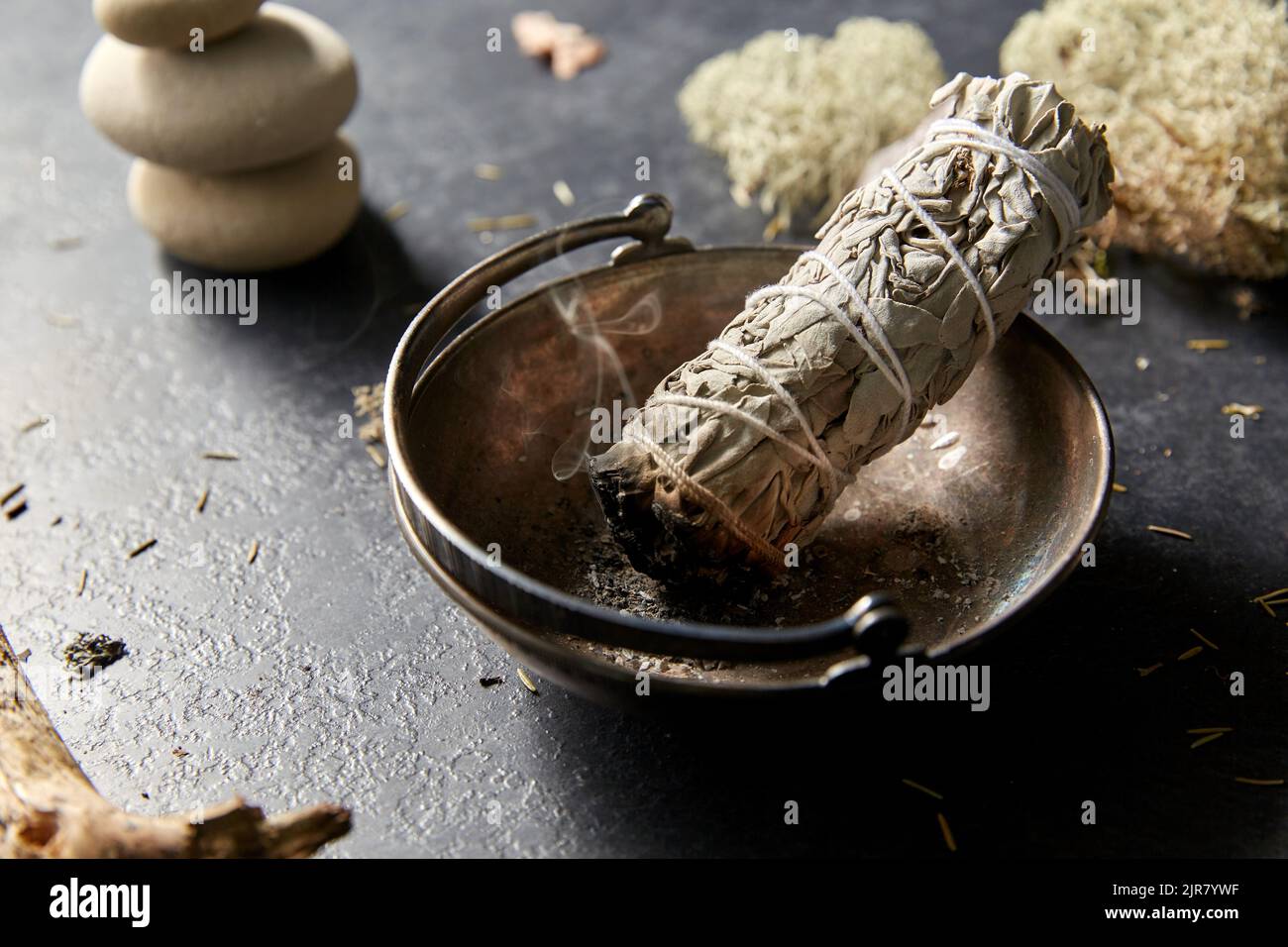 smoking white sage in cup and other magic staff Stock Photo - Alamy