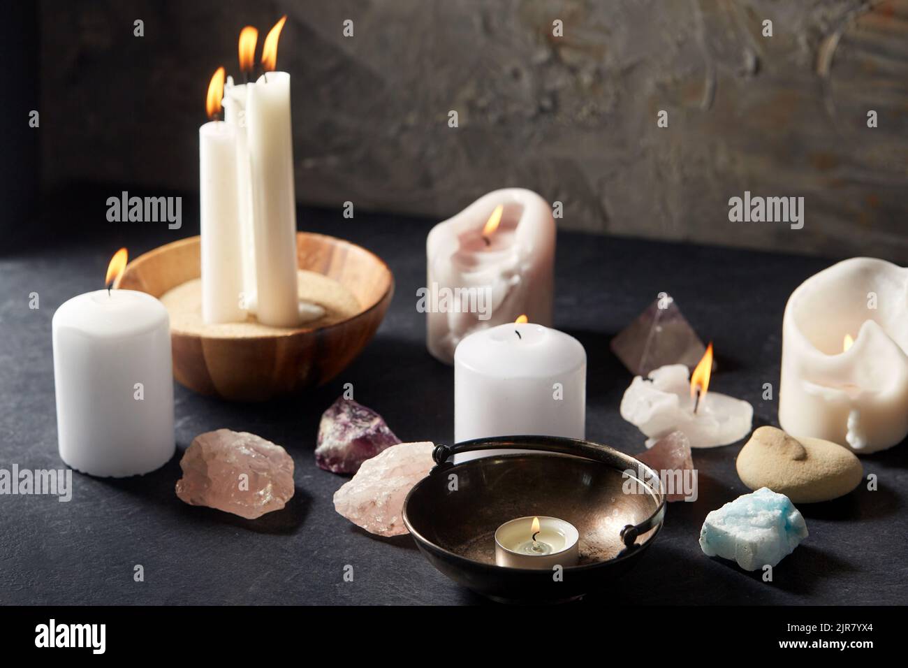 burning candles and crystals for magic ritual Stock Photo - Alamy