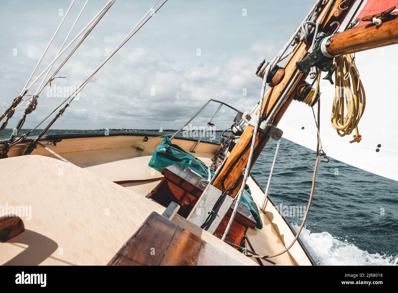 A classic sailing yacht slanting in the sea Stock Photo - Alamy