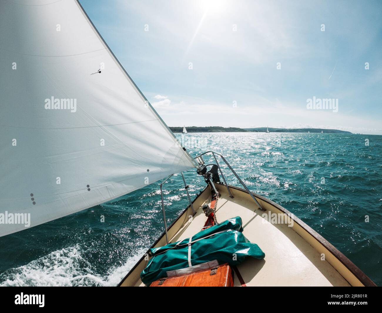 A classic sailing yacht slanting in the sea Stock Photo - Alamy