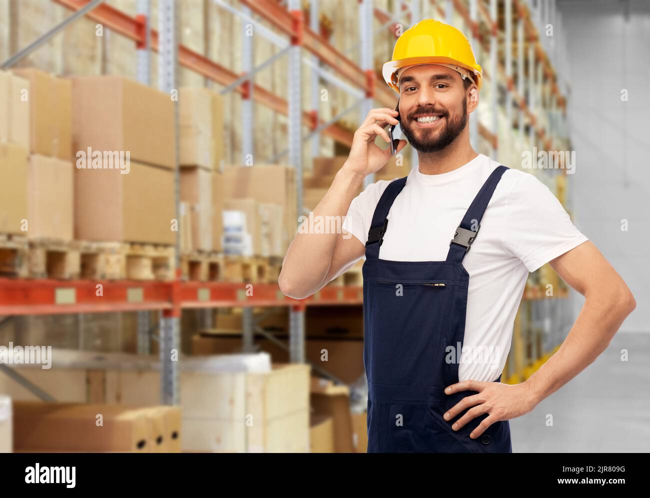 male worker calling on smartphone at warehouse Stock Photo - Alamy