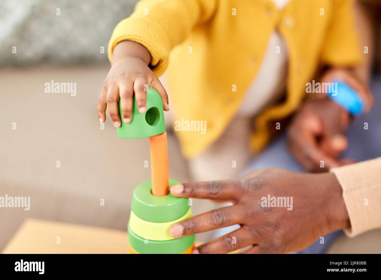 close up of baby playing toy blocks at home Stock Photo - Alamy