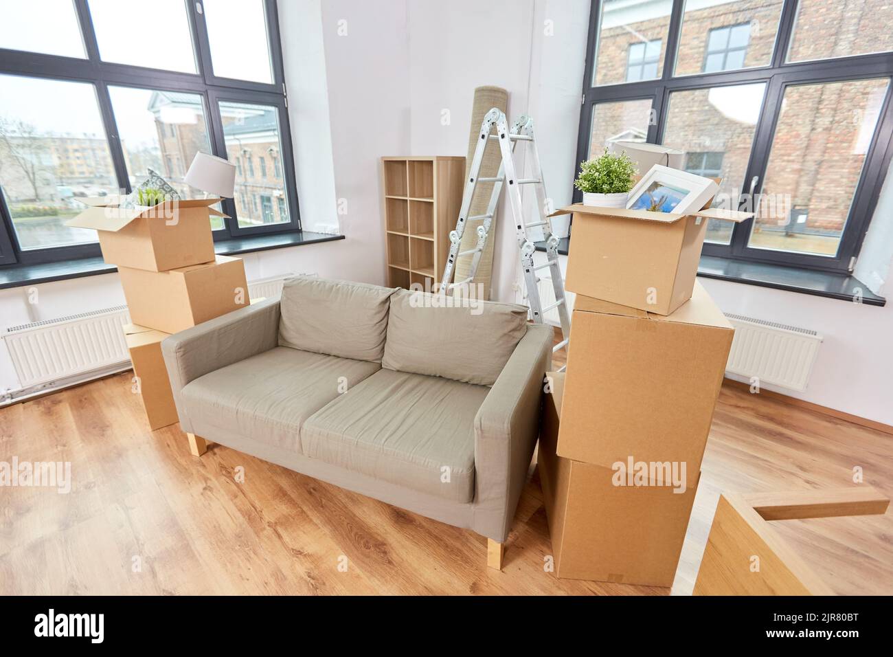 sofa and corrugated boxes with stuff at new home Stock Photo - Alamy