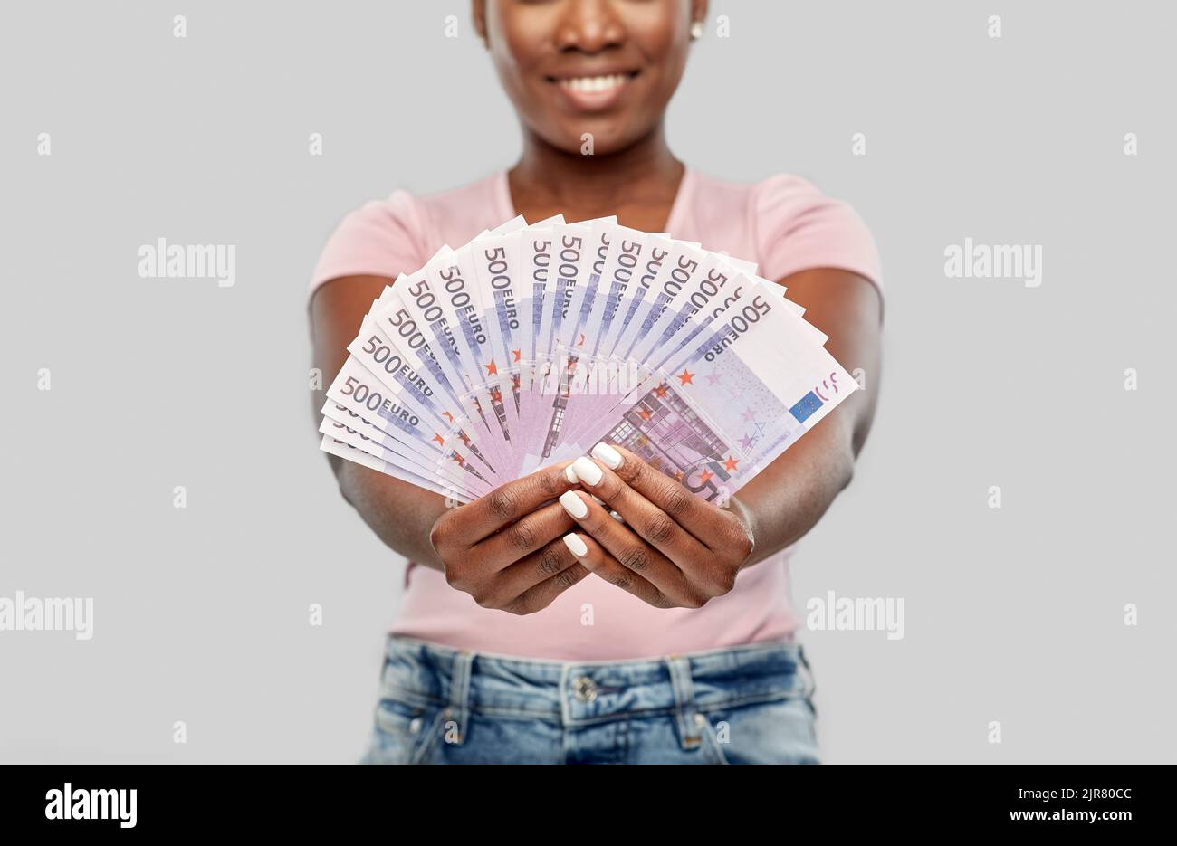 happy african american woman with euro money Stock Photo - Alamy