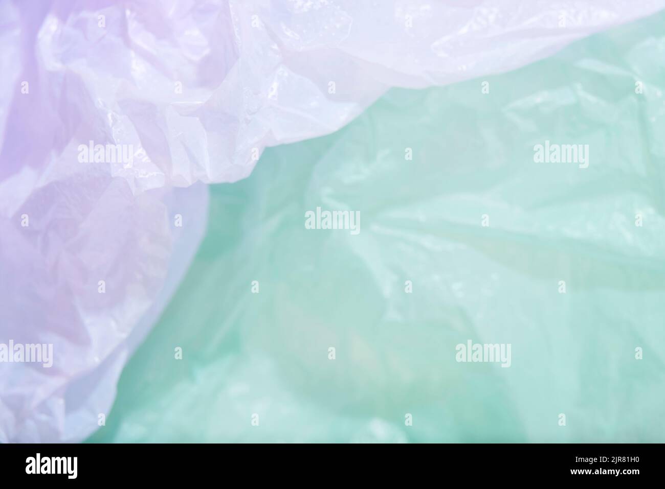 Green and purple background, single use plastic bags. Concepts ...