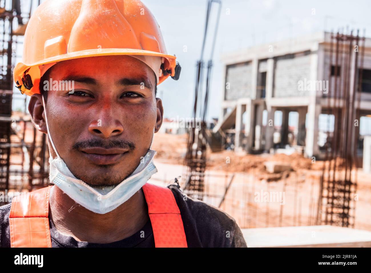 Latino indigenous blue collar worker in the construction of a work ...