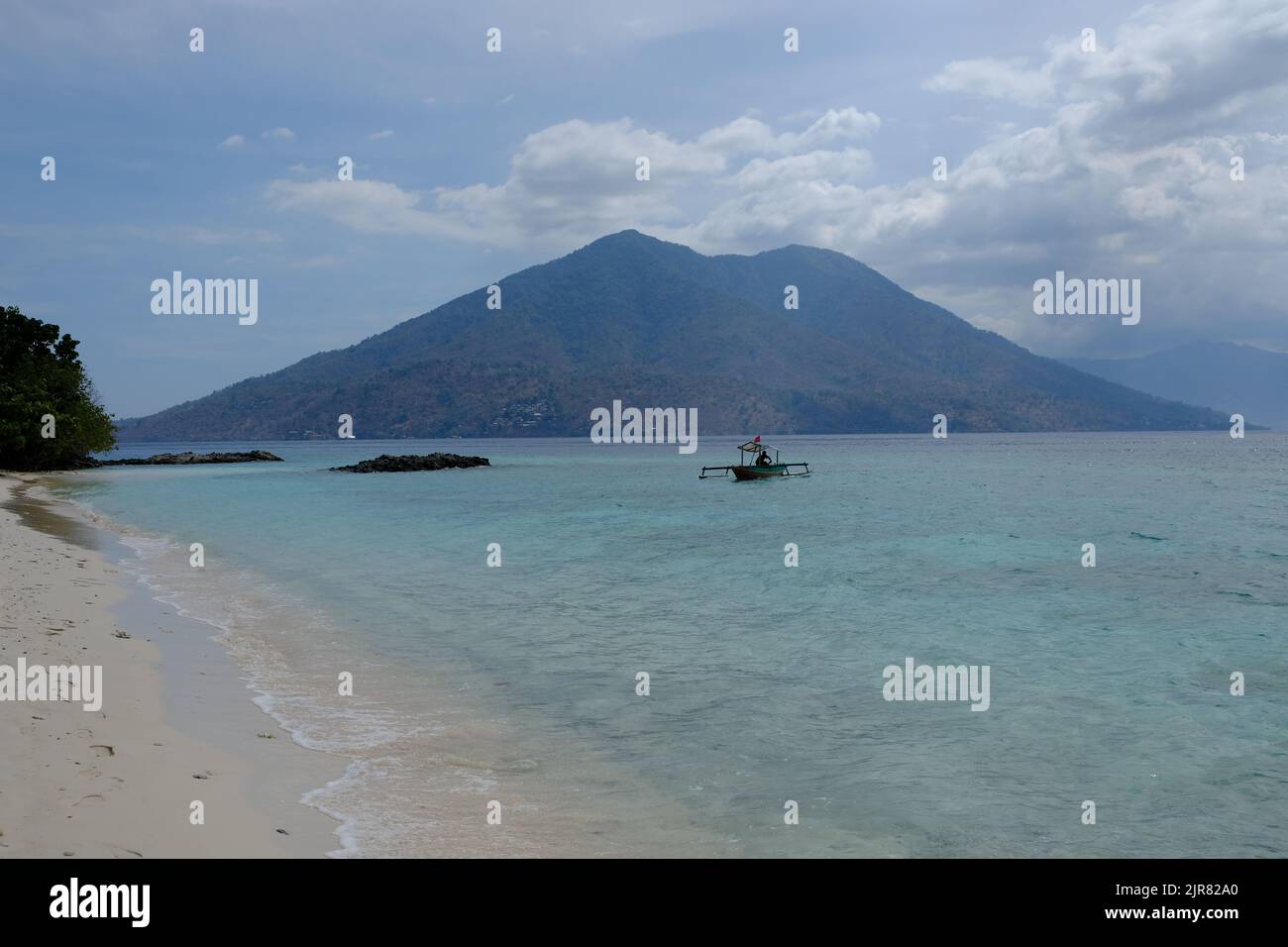 Indonesia Alor Island - Seascape with volcanic mountain Stock Photo - Alamy