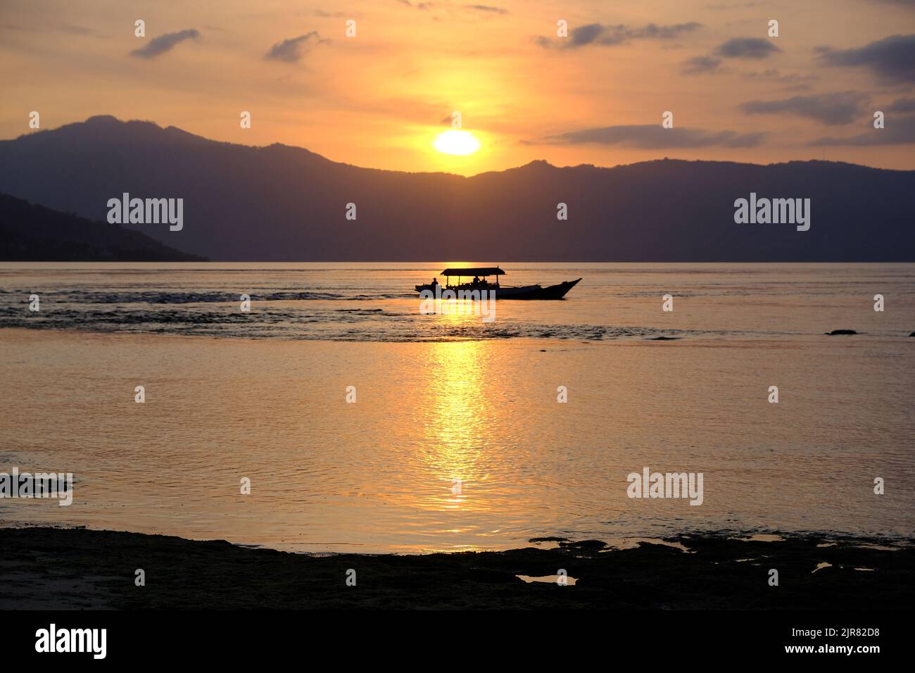 Indonesia Alor Island - Ocean landscape with fishing boat at sunset ...