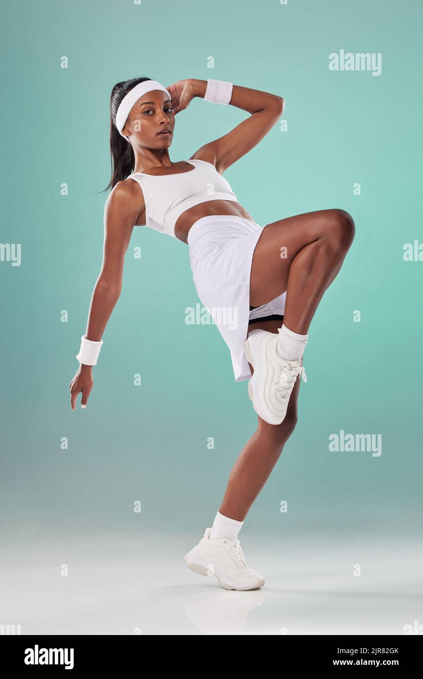 Fit, athletic and cute female tennis player or athlete woman with a ...