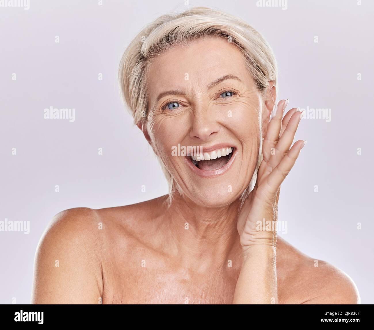 Portrait of a happy woman showing healthy skin with smile, advertising ...