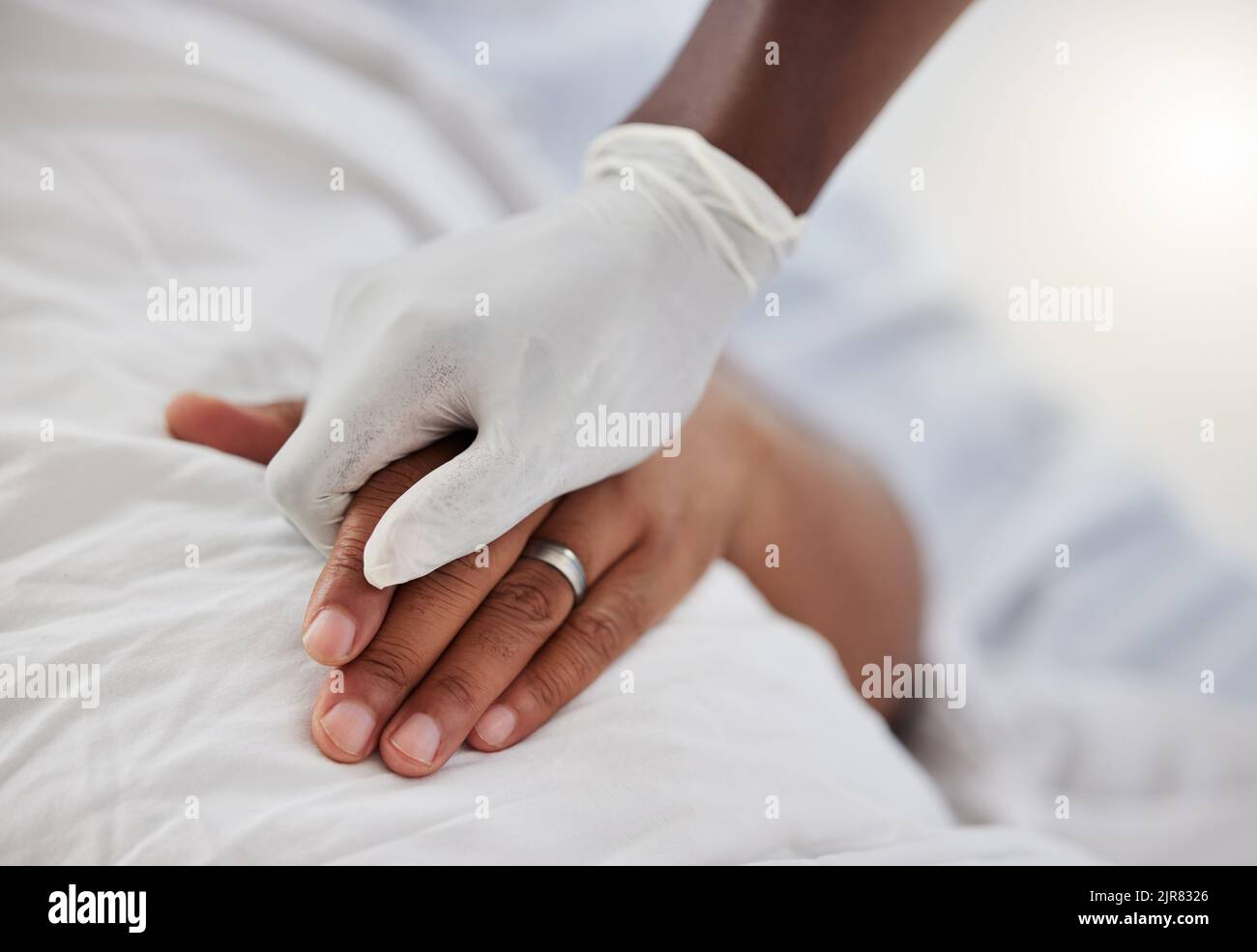 Doctor, healthcare worker and medical professional holding hands to ...