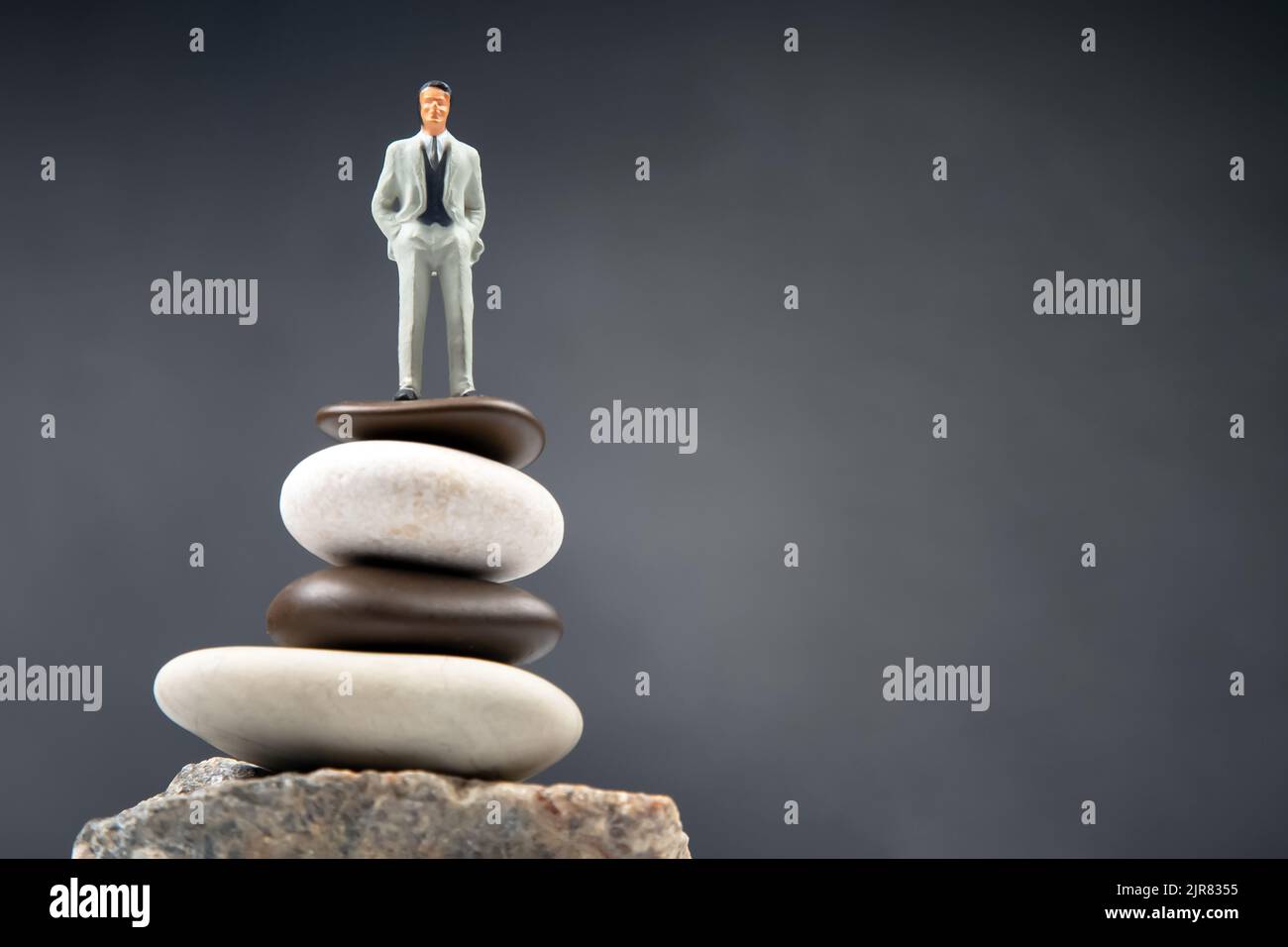 Miniature man on stones hi-res stock photography and images - Alamy
