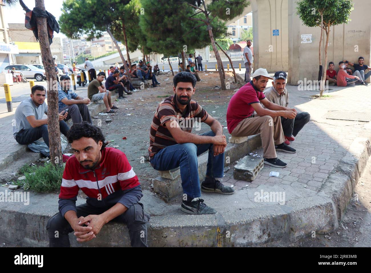 Lebanon. 20th Aug, 2022. Syrian men wait to be hired for day work in ...