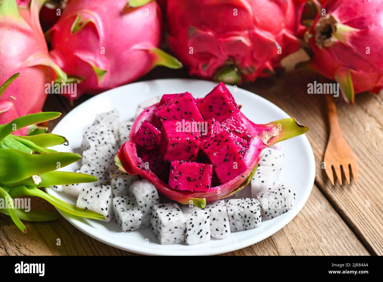 dragon fruit slice on white plate with pitahaya background, fresh white ...