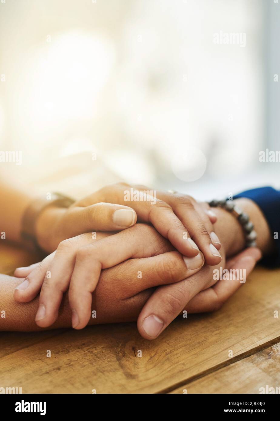 Help will always be within reach. Closeup shot of two unrecognizable ...