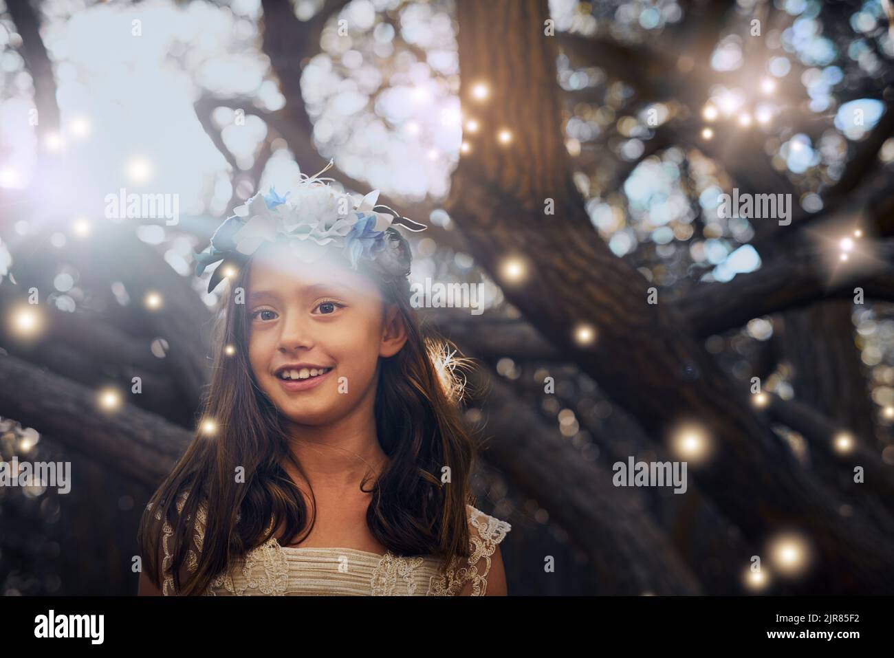 Children always see the magic in life. Portrait of a little girl ...
