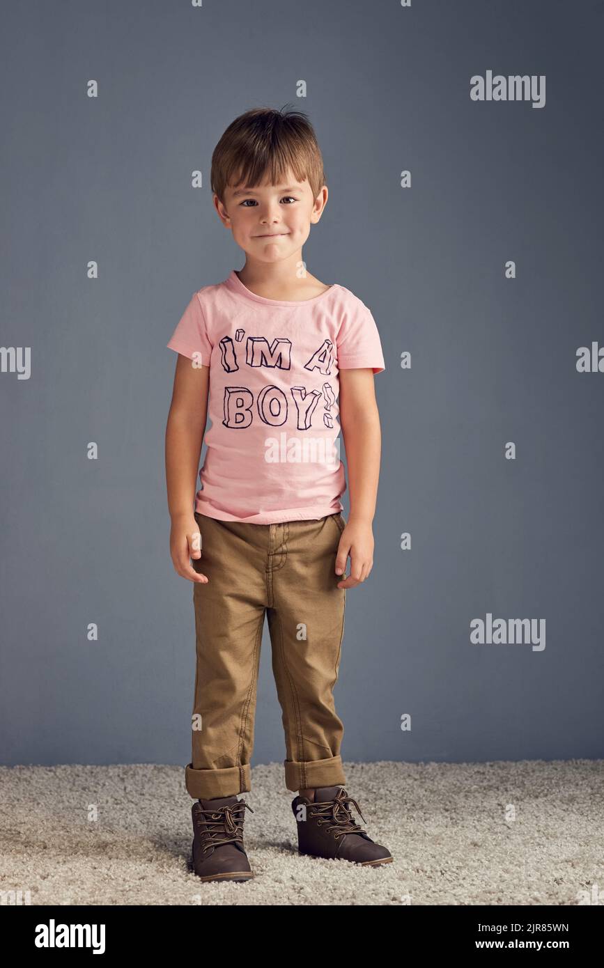 Boys wear pink too. Studio portrait of a boy wearing a t shirt with Im ...