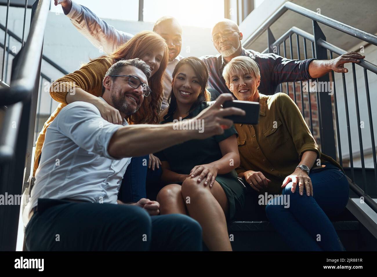 Group of people sitting on steps hi-res stock photography and images ...