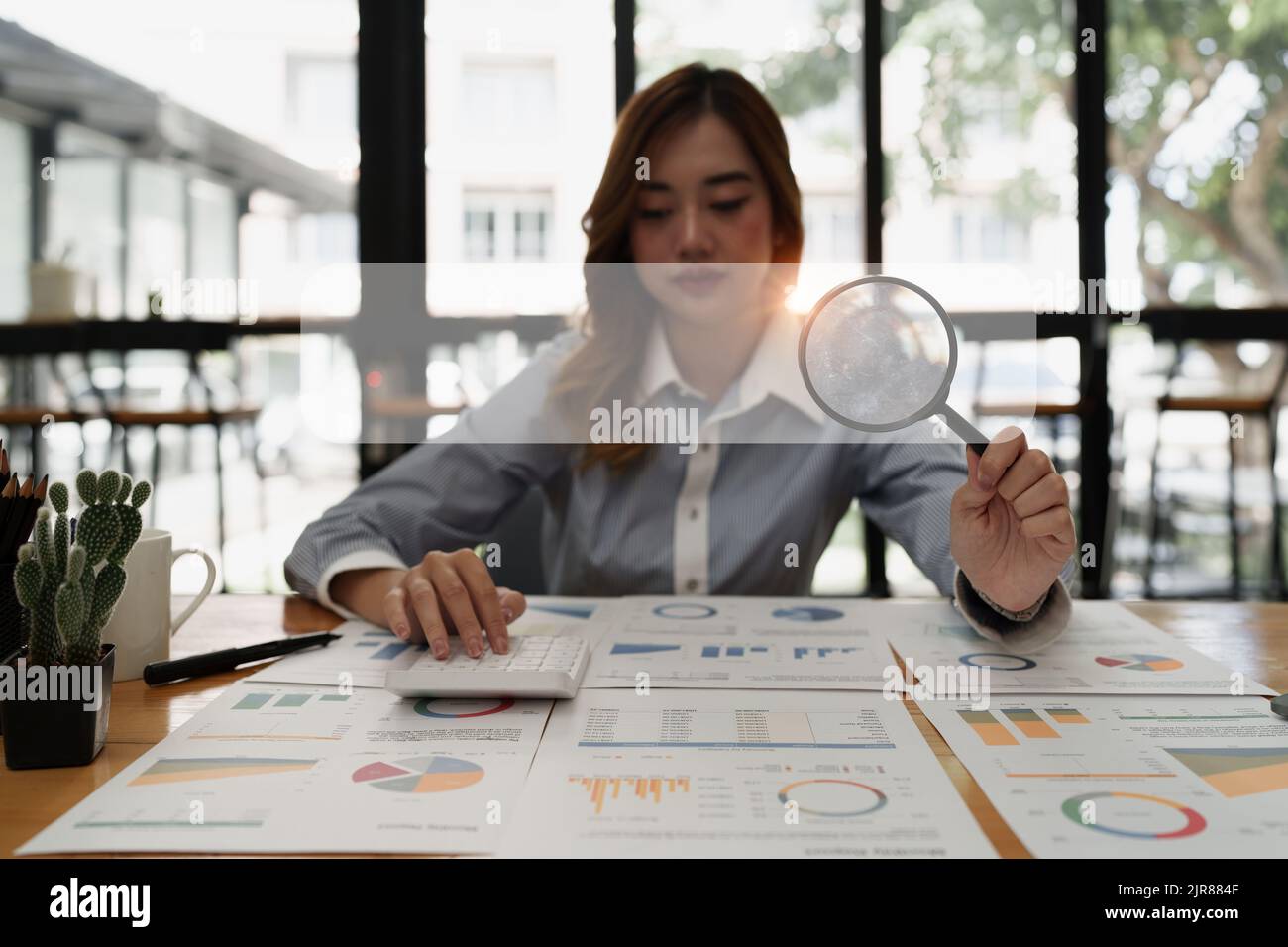 Modern business woman audit and searching on finance paperwork document ...