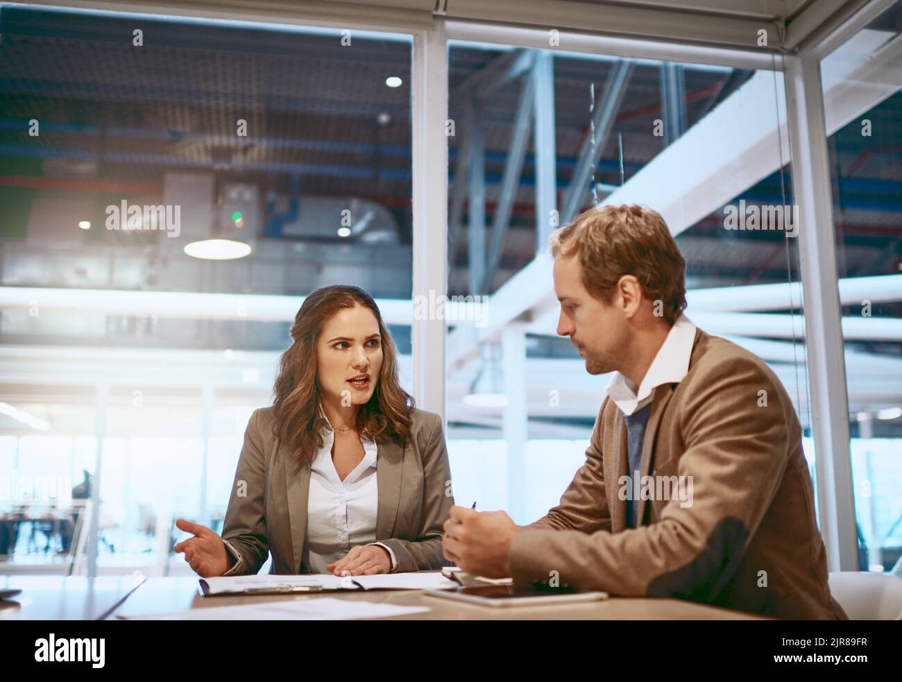 Looks like a heated discussion. two businesspeople working together in ...