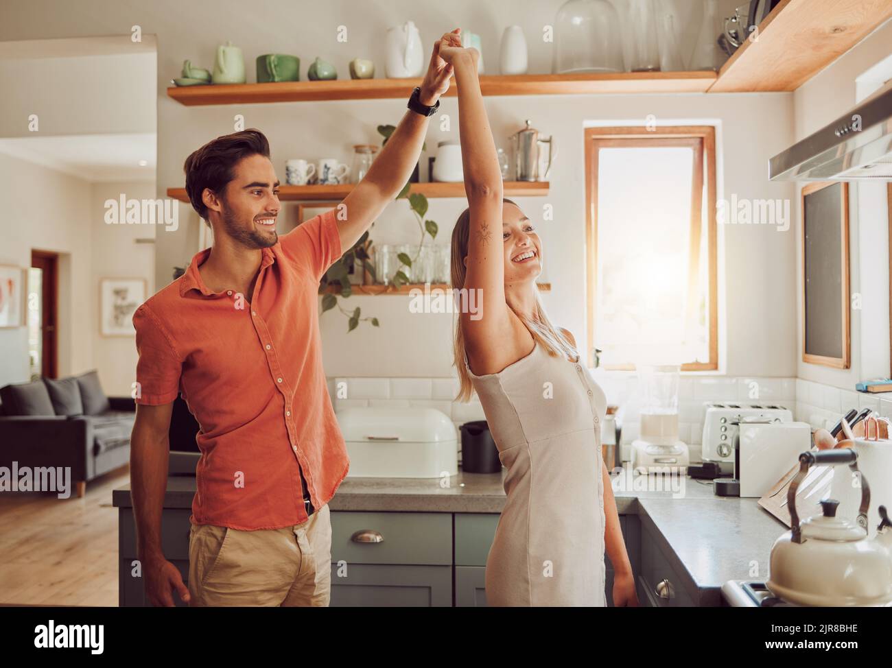 Happy, dancing and loving couple bonding and having fun while spending ...