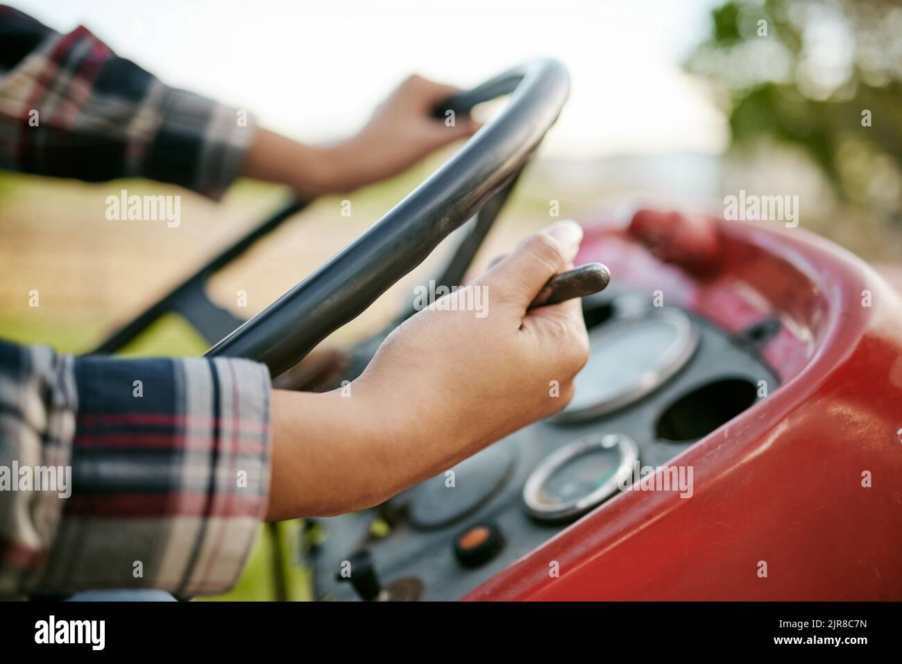 Farm, tractor and agriculture with hands of a farmer driving a vehicle ...
