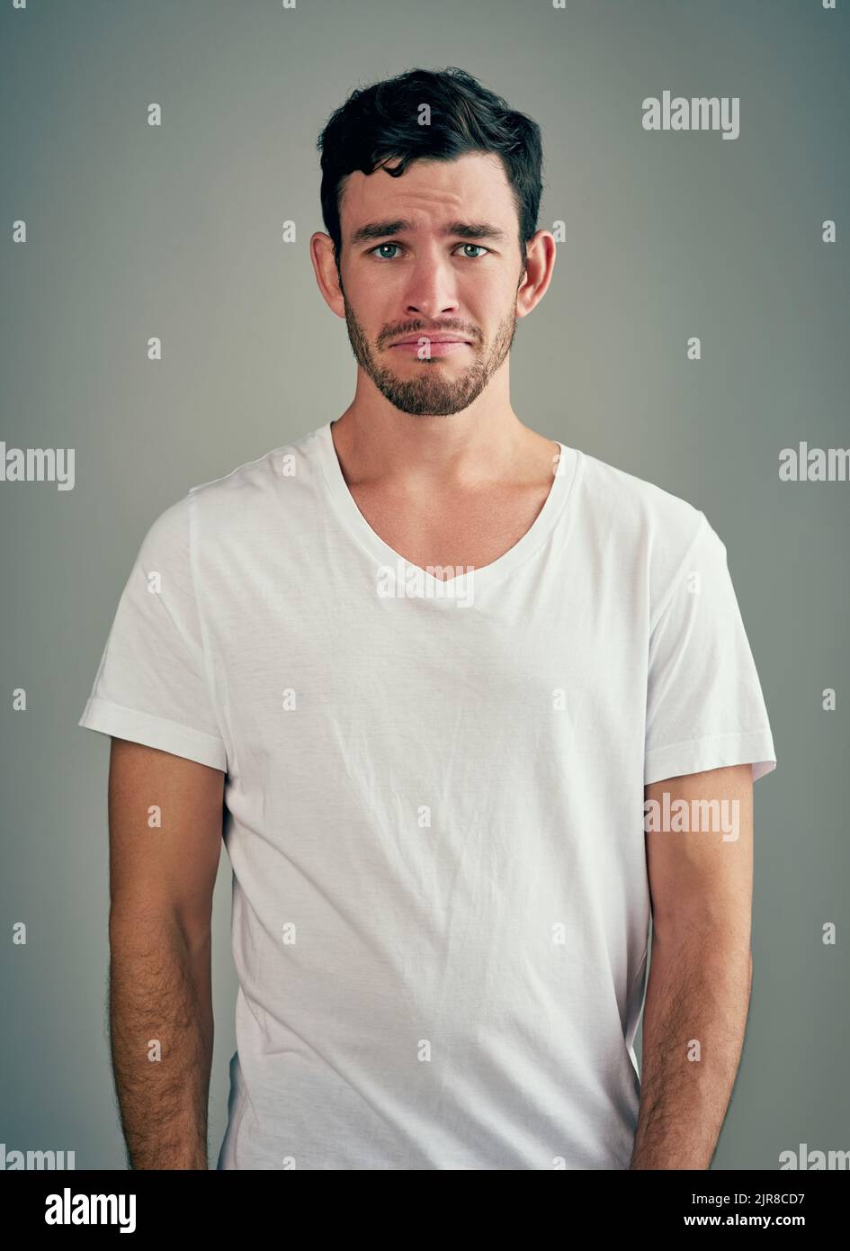 Feeling down and Im not sure what to do. Studio shot of a casual young ...