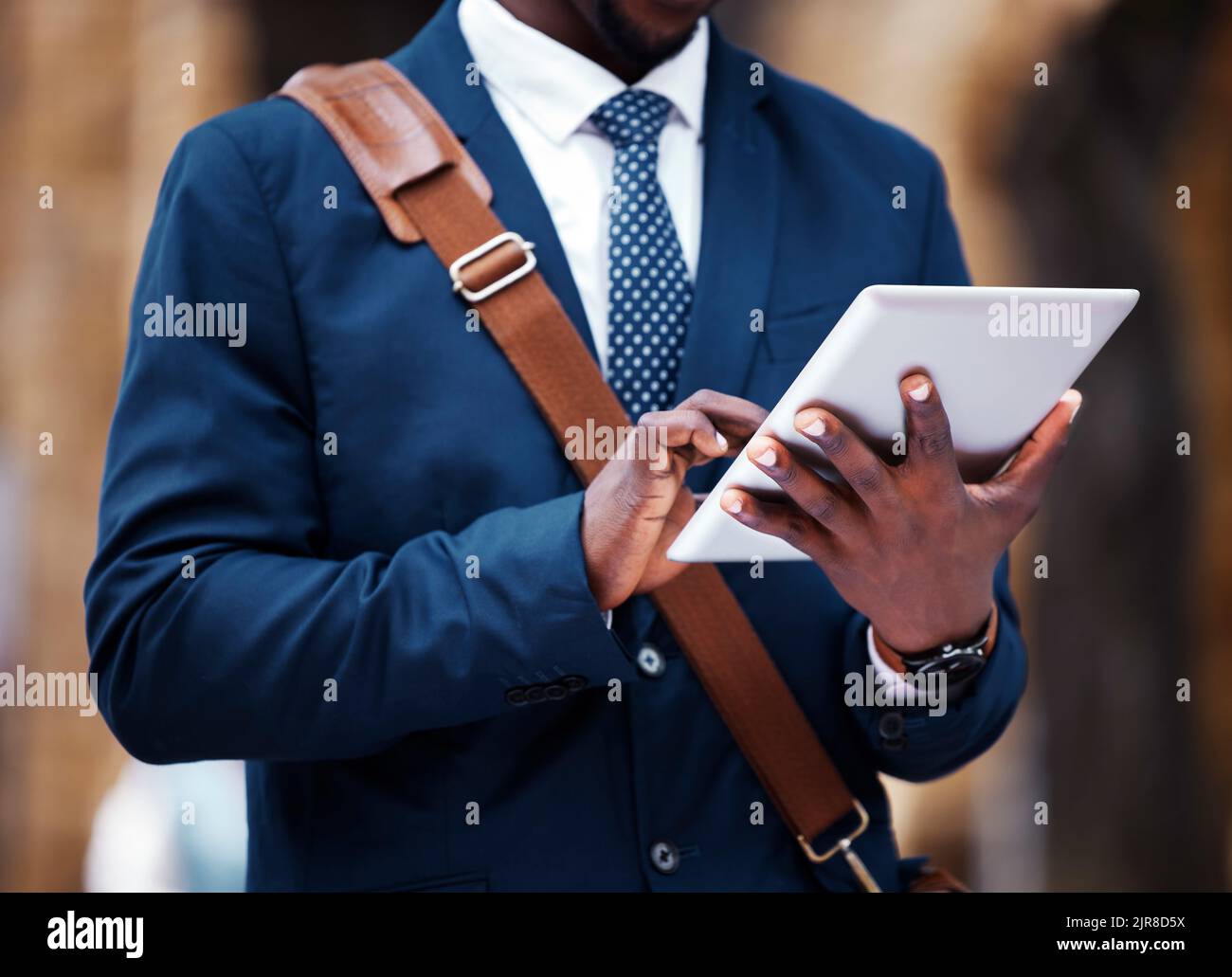 Hand of business man working on 5g digital tablet in city, typing email ...