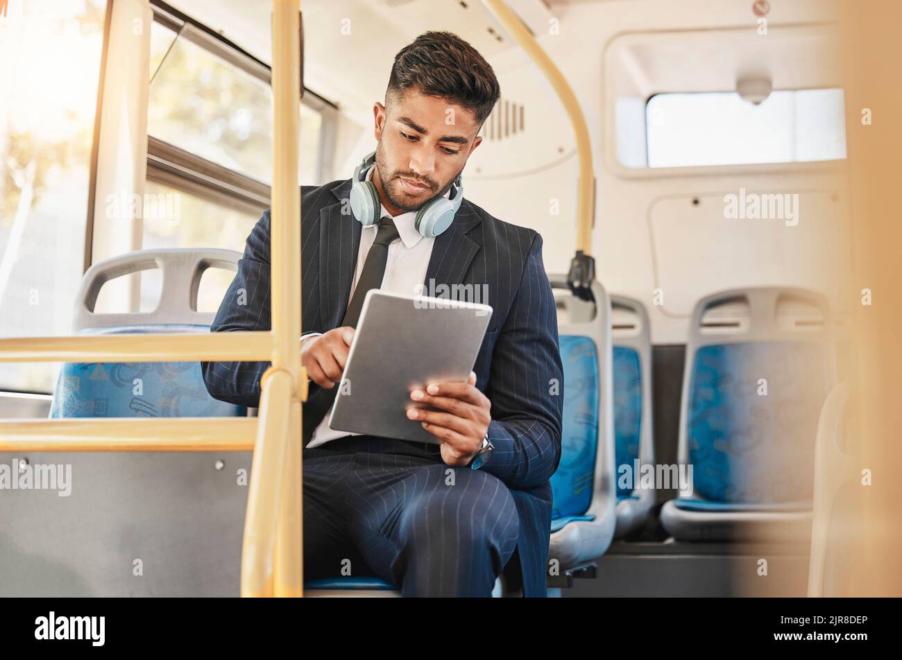 Business man, using tablet and bus for travel to work, home or working ...