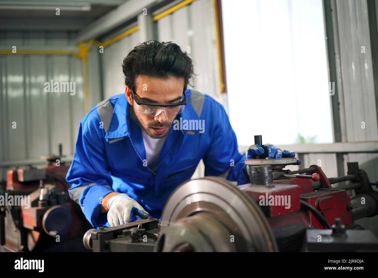 Workers changing and repair part of wheels at the car service Stock ...
