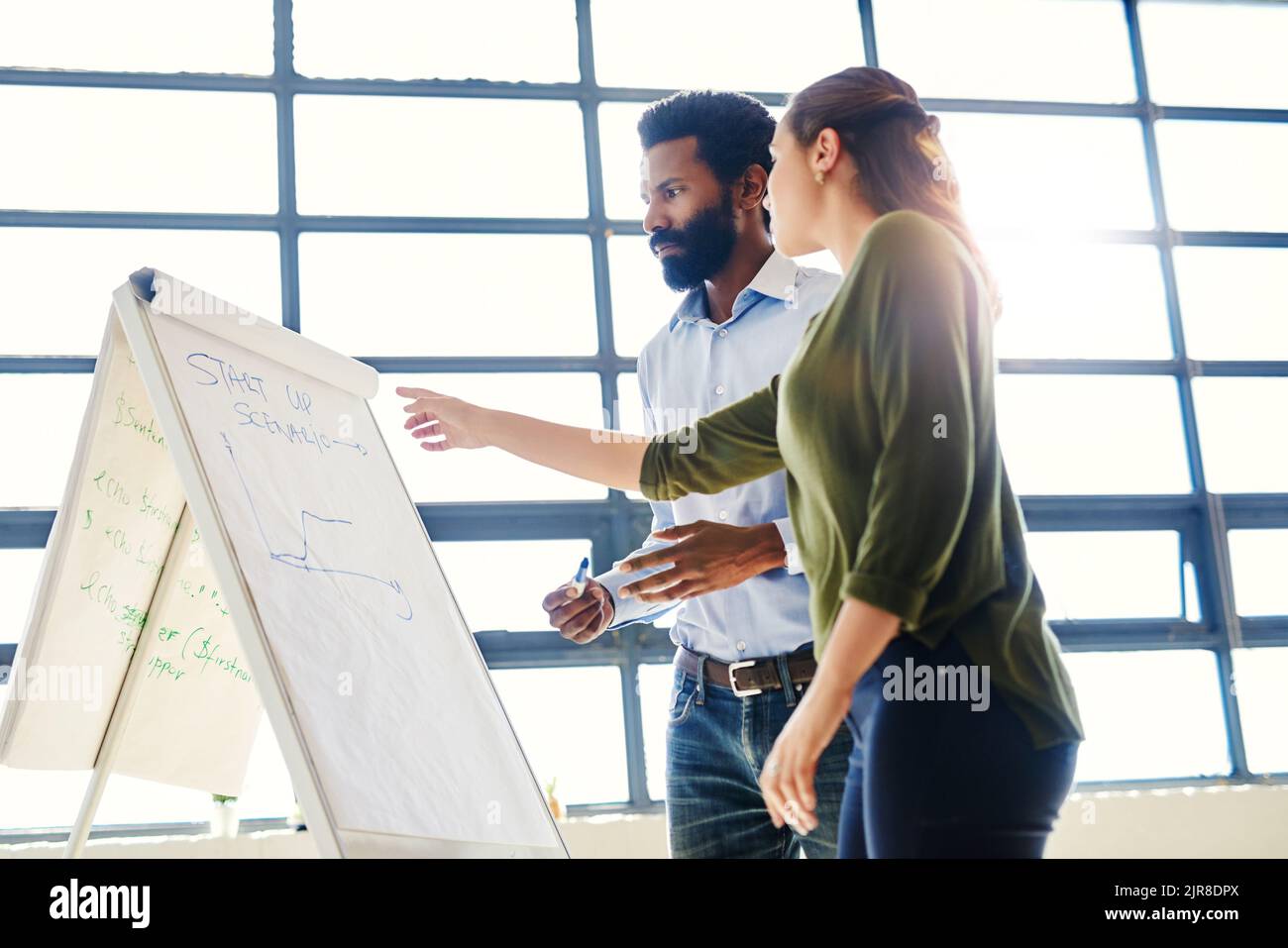 Success is more easily achieved together. two businesspeople ...