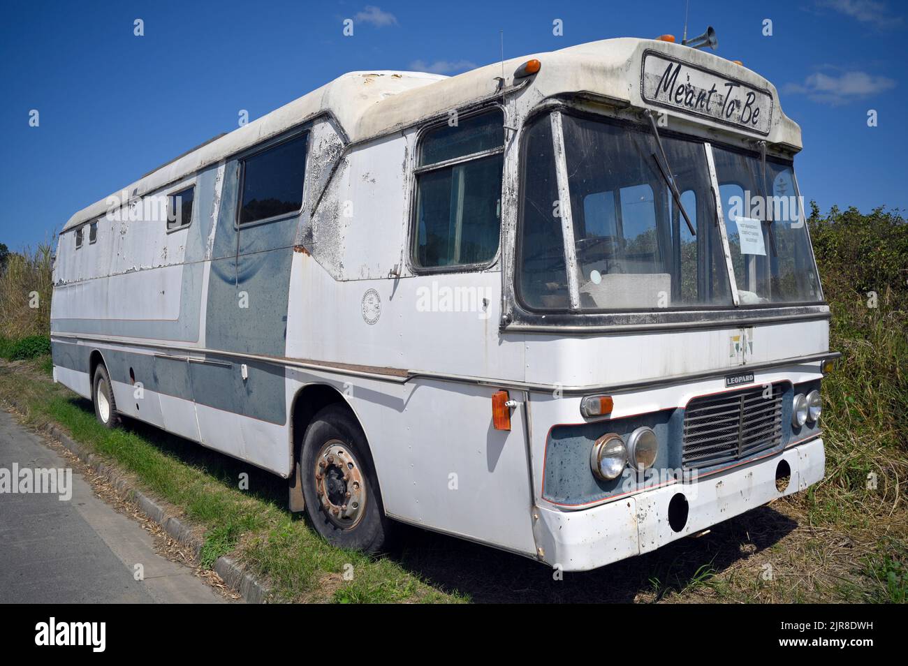 Old bus coverted for travel around Australia at the side of the road in ...