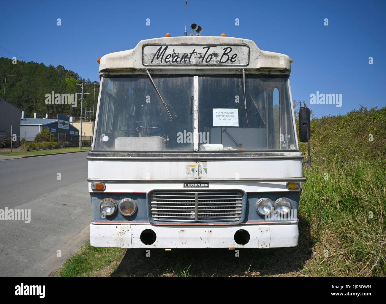 Old bus coverted for travel around Australia at the side of the road in ...