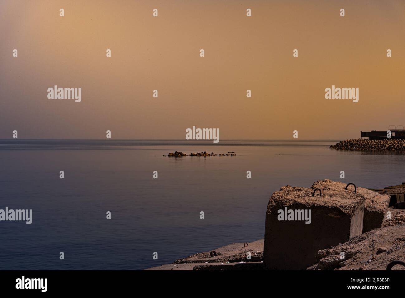 Huge concrete blocks on the rocky coast of Alexandria in Egypt during ...