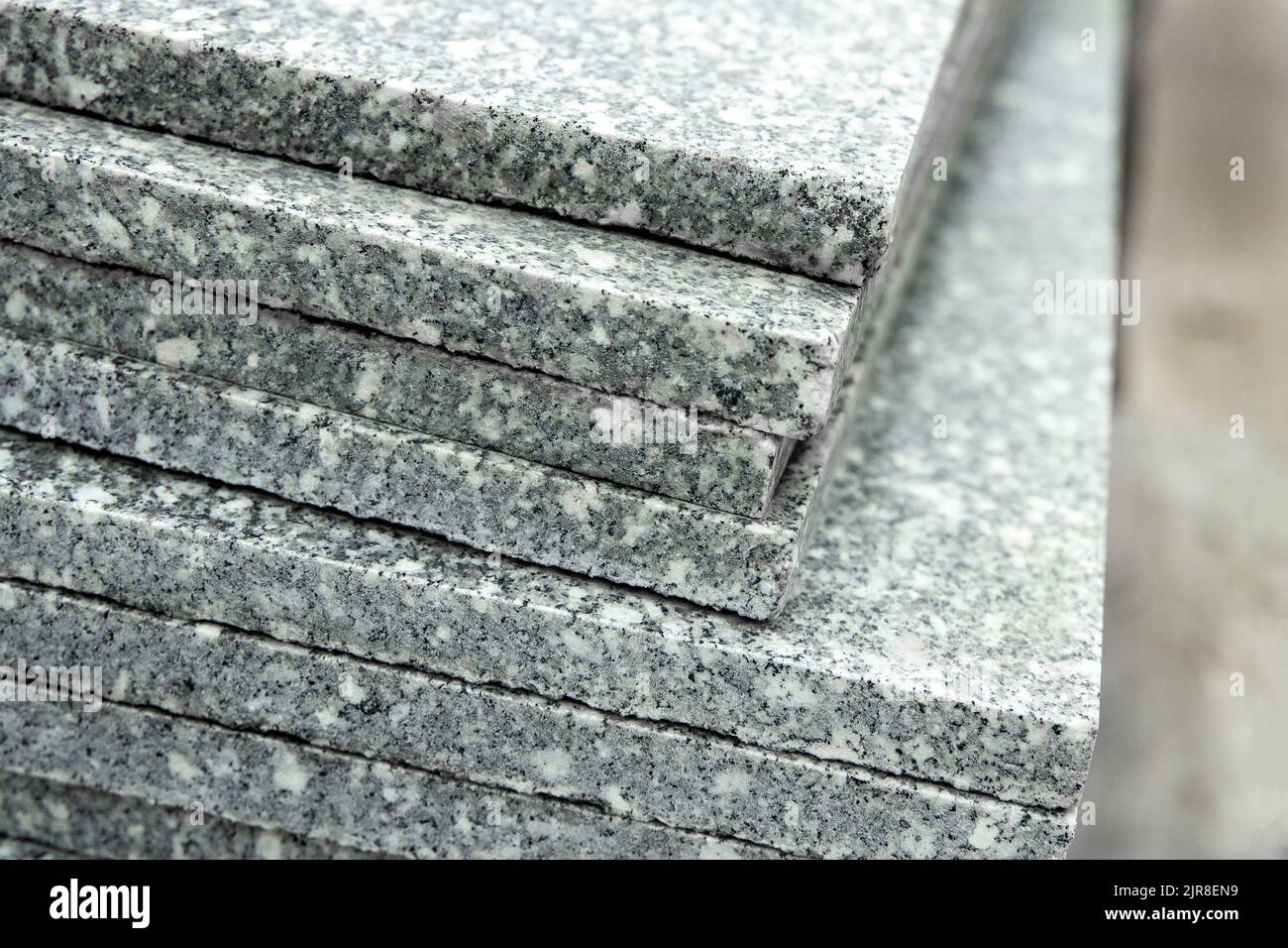 Close-up on polished granite tiles stacked on top of each other Stock ...