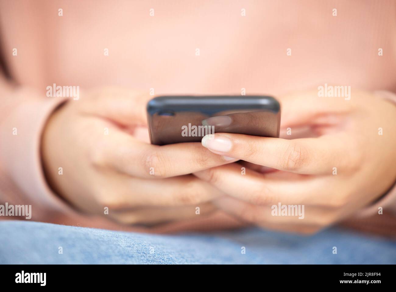 Texting, closeup and hands holding phone while typing an email or memo ...