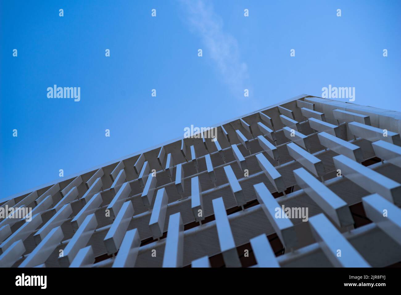 Corner of a modern steel building with geometric surface Stock Photo ...