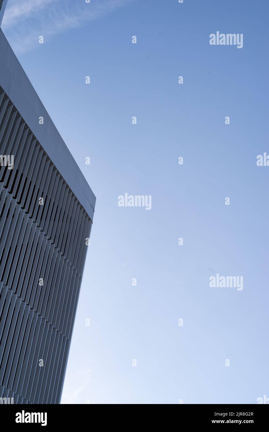 Corner of a modern steel building with geometric surface Stock Photo ...