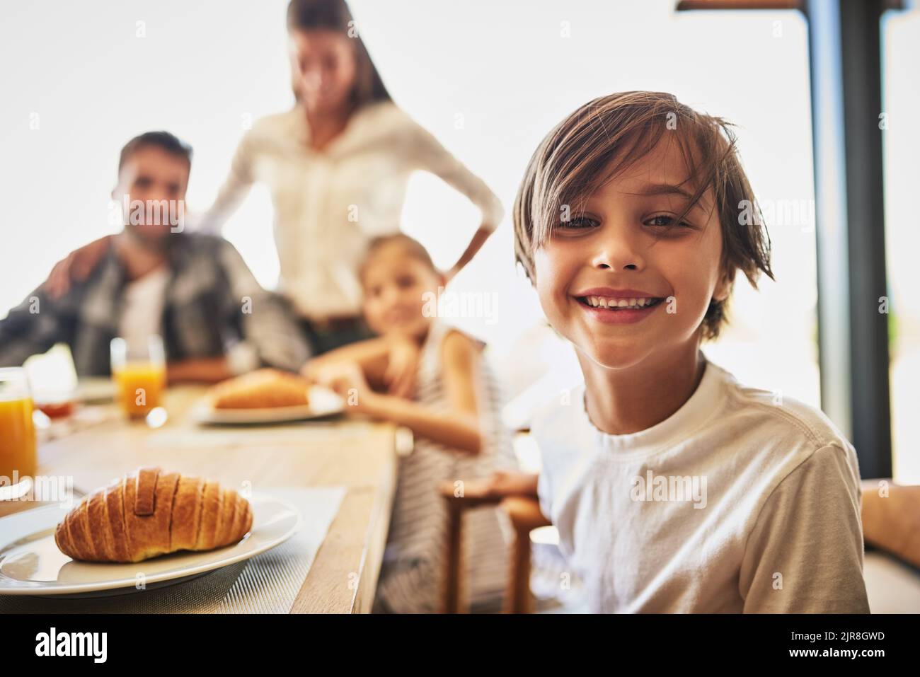 Breakfast time is the best. Portrait of a little boy having breakfast ...