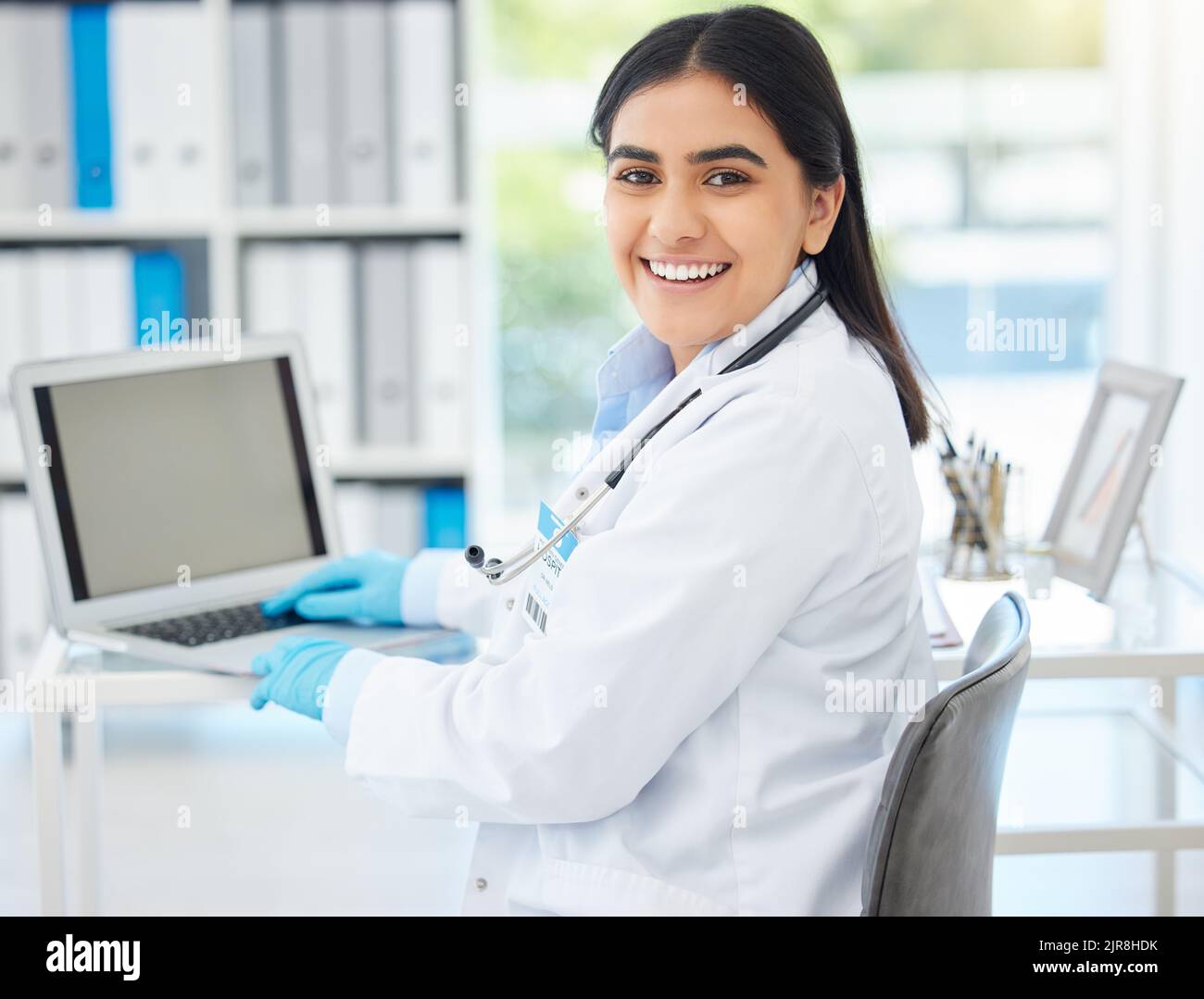 Doctor, smile and working on laptop mockup with medical healthcare ...