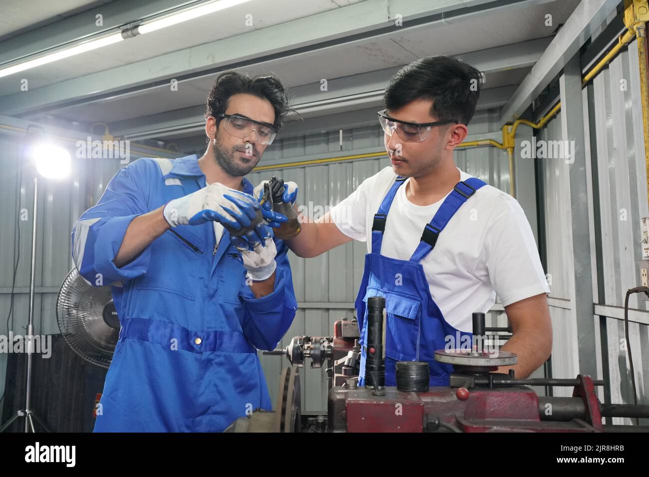 Workers changing and repair part of wheels at the car service Stock ...