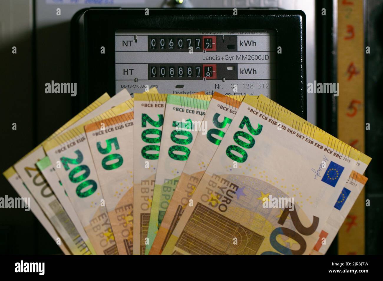 Electricity cost in European countries. euro bills on electric meter ...