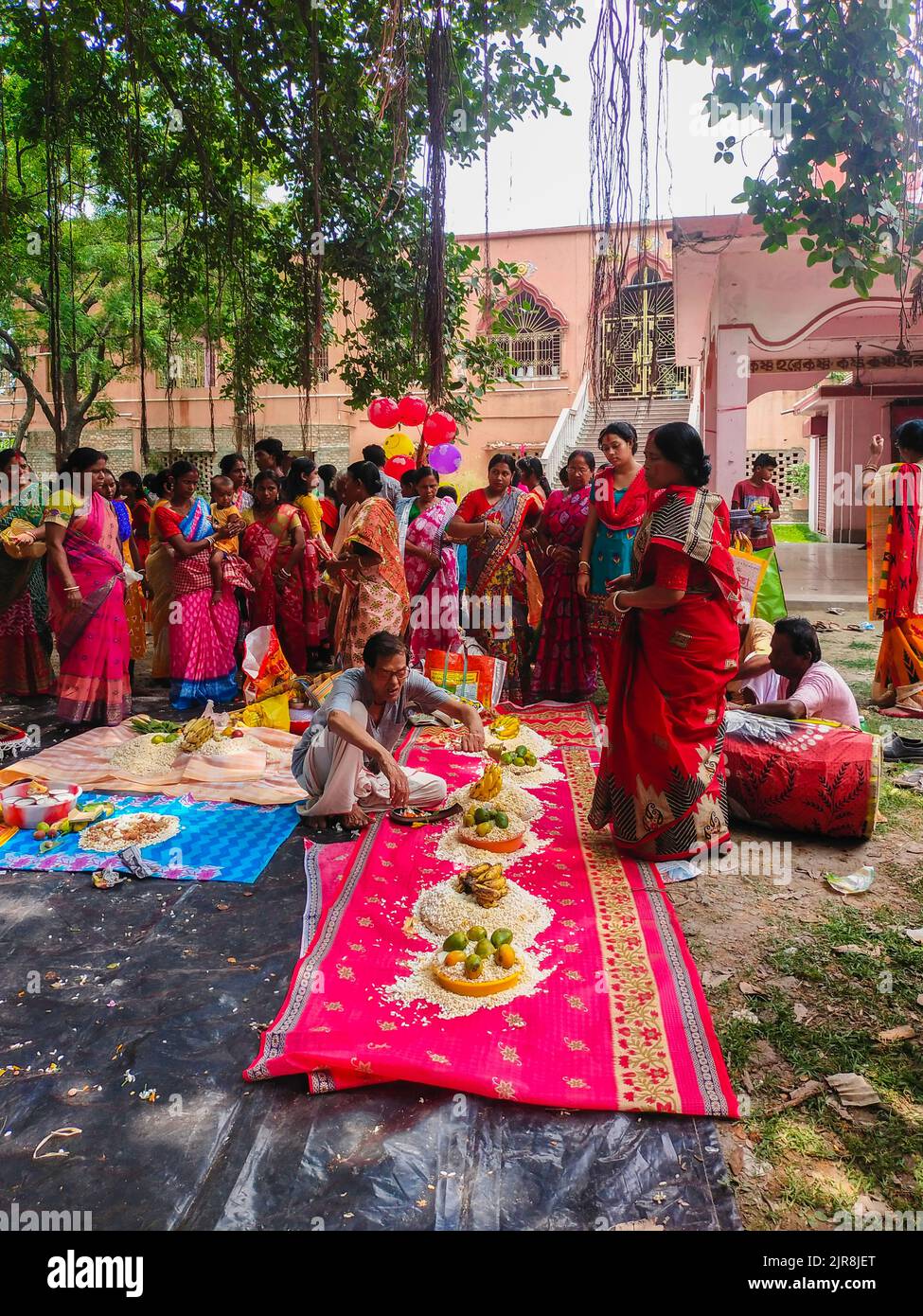 A vertical shot of a Hindu priest performing rituals for the new ...