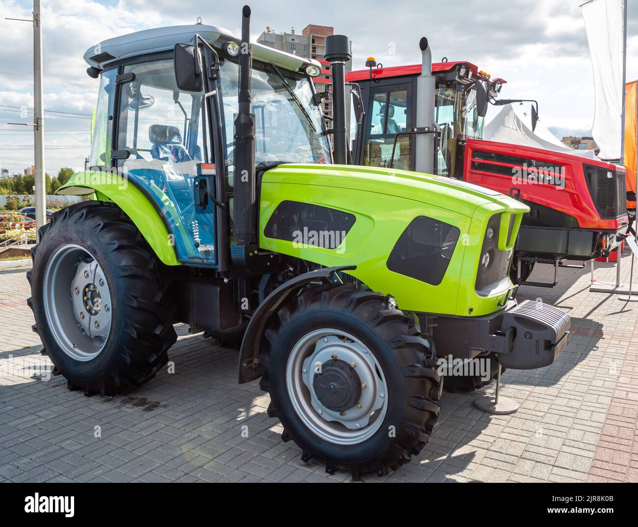 Modern wheeled tractors in the parking lot Stock Photo - Alamy