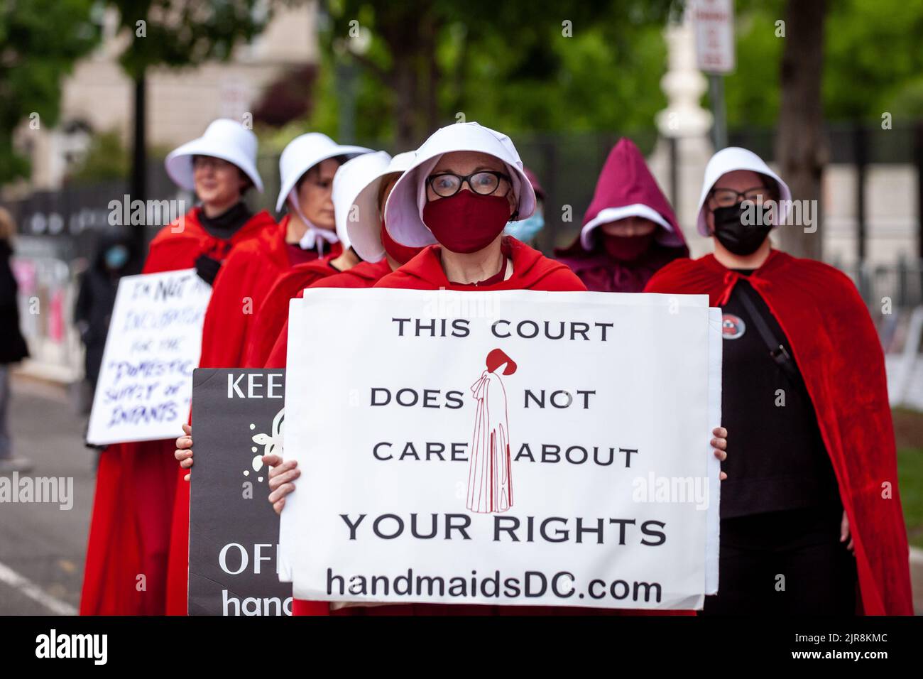 Demonstrators dressed as handmaids from The Handmaid's Tale, walk in ...