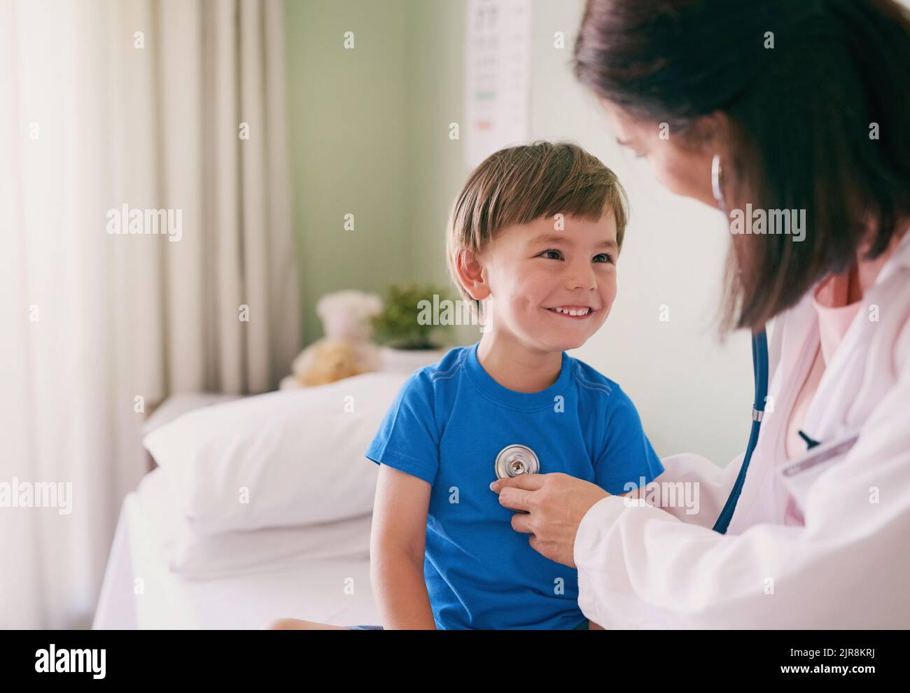 The doctors office should be a friendly place. a female doctor checking ...