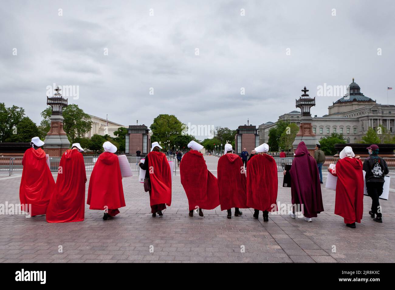 Demonstrators dressed as handmaids from The Handmaid's Tale, depart the ...