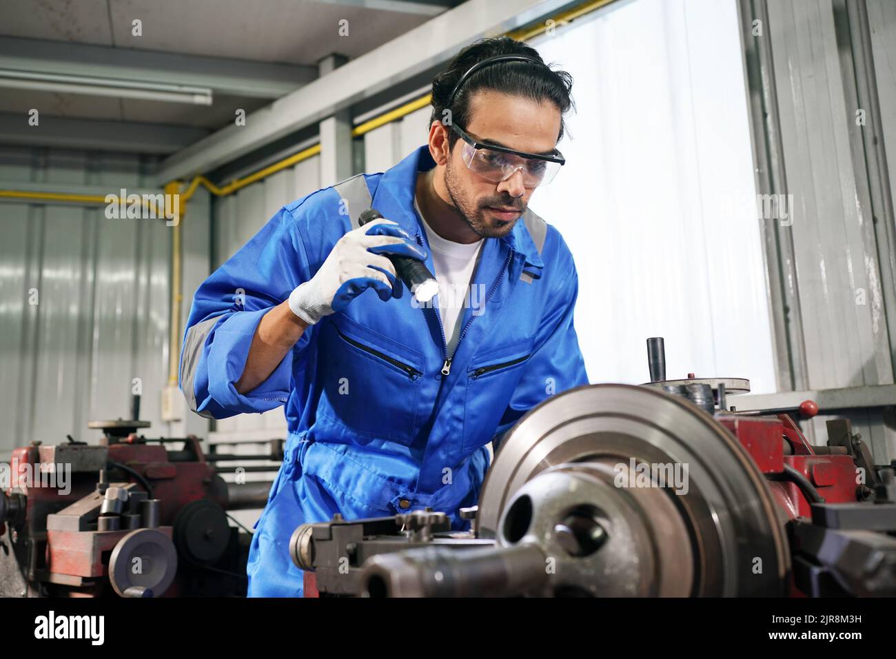 Workers changing and repair part of wheels at the car service Stock ...