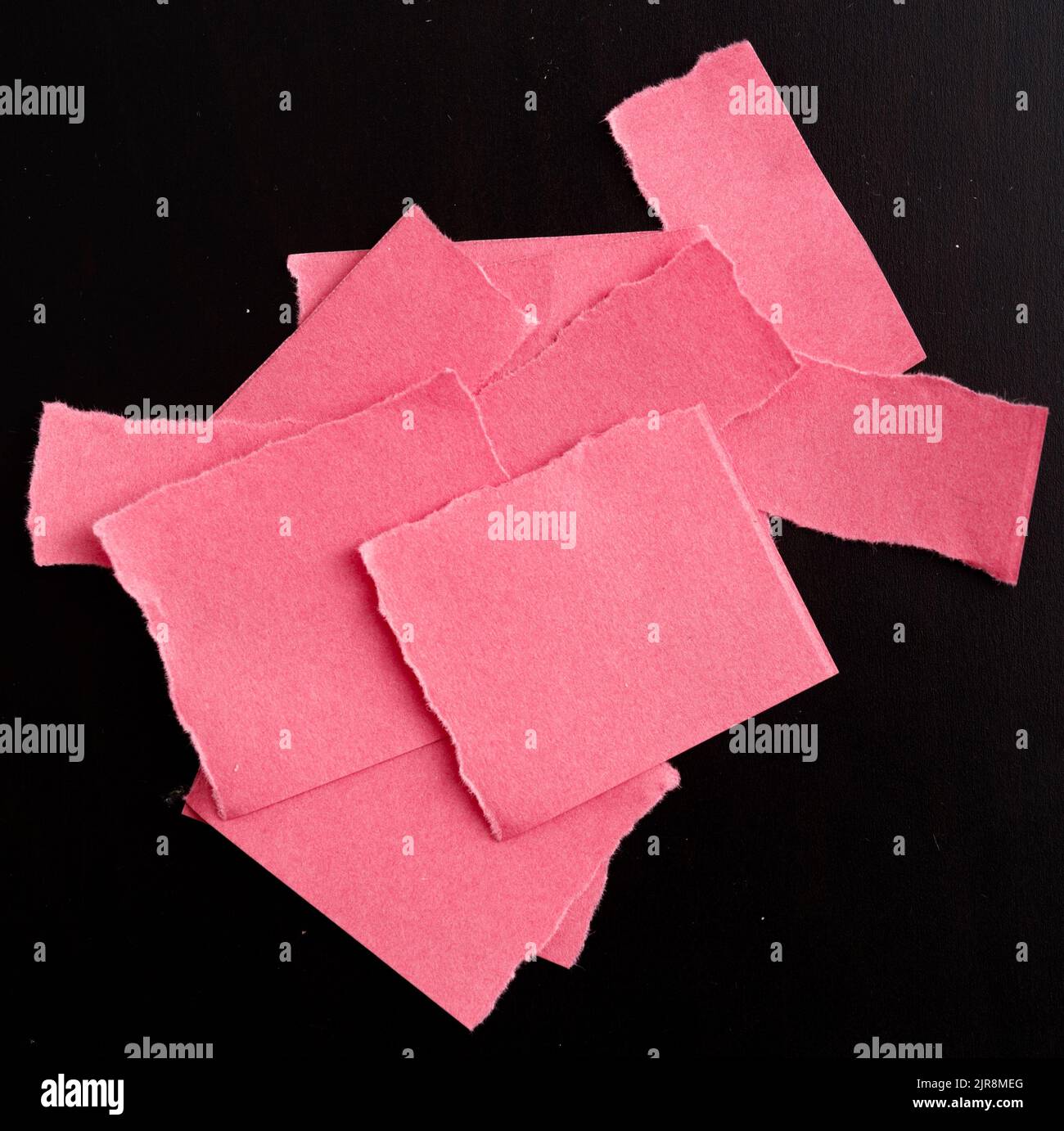 Red torn paper on black background Stock Photo - Alamy