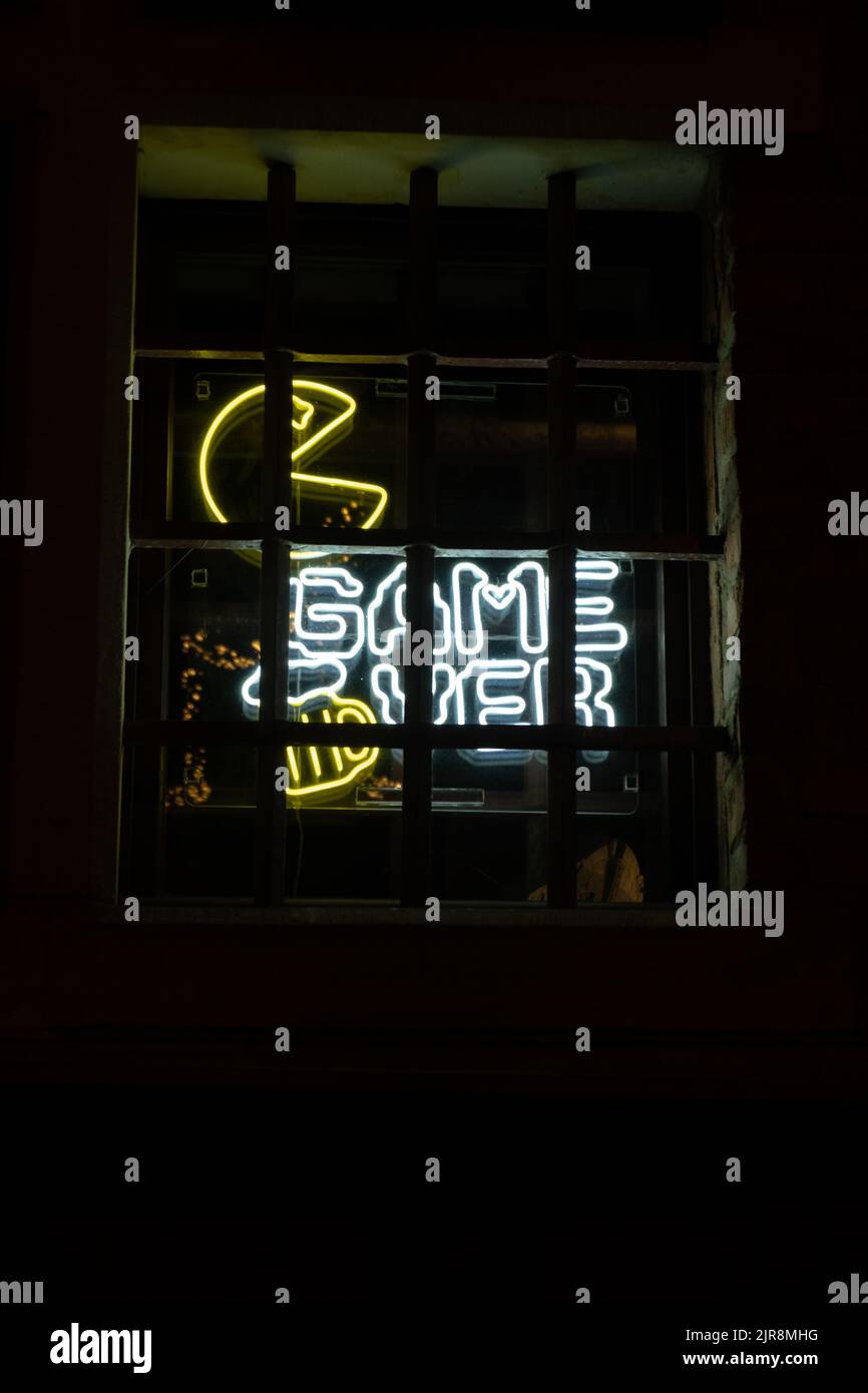 Game over inscription in neon lights at night. Electric sign at night ...